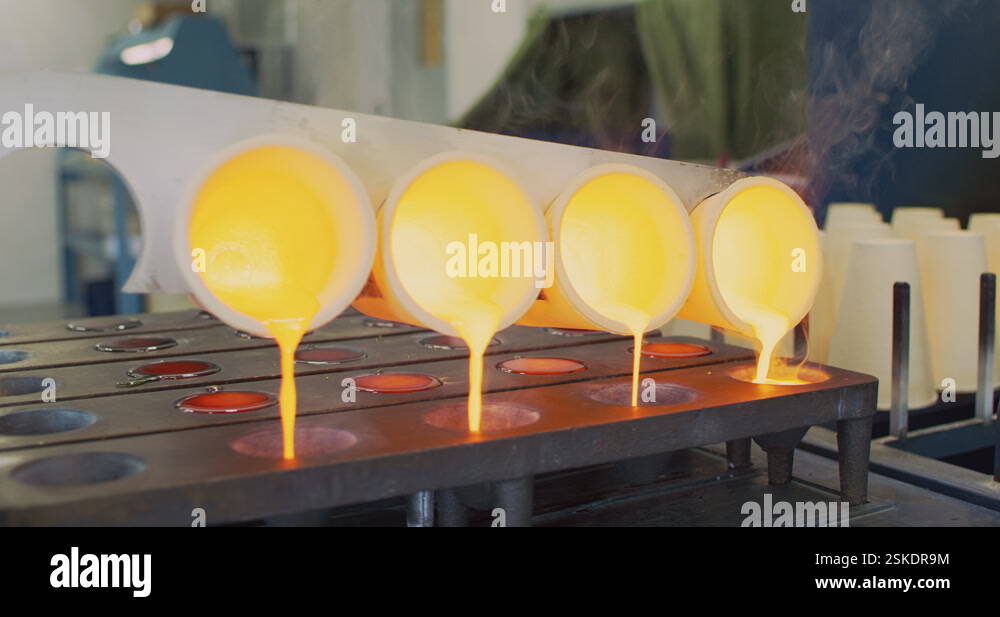 Liquid Gold from induction furnace is Pouring From White Vessels to the ...