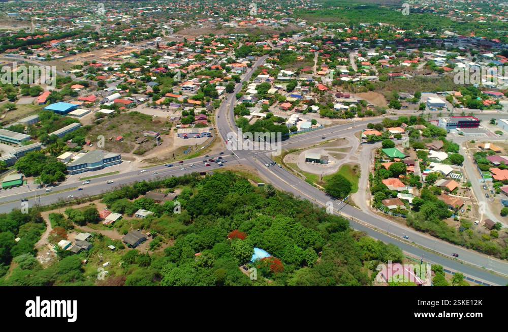Drone tilt down bird's eye view road intersection four way, curacao ...