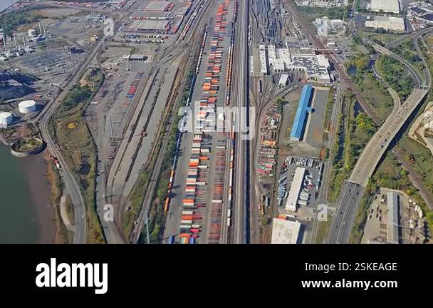 Aerial view of cargo train terminal with containers and tracks in an ...