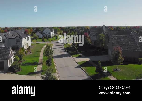 Quiet suburban street with modern homes, Aerial view of a quiet ...