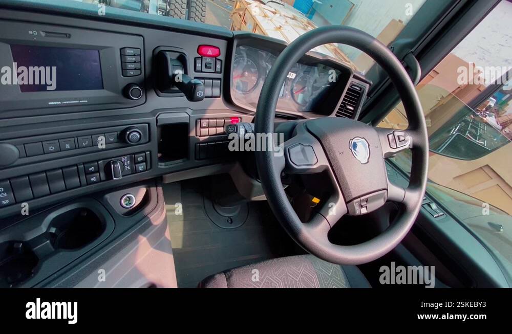 Driver's cabin of SCANIA P410 XT. Truck interior with steering wheel ...