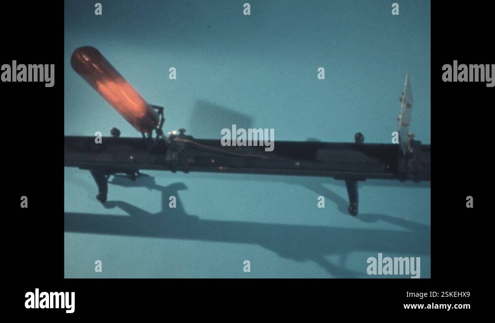 1960s: A electric bulb is mounted on beam connected to metal rectangle ...