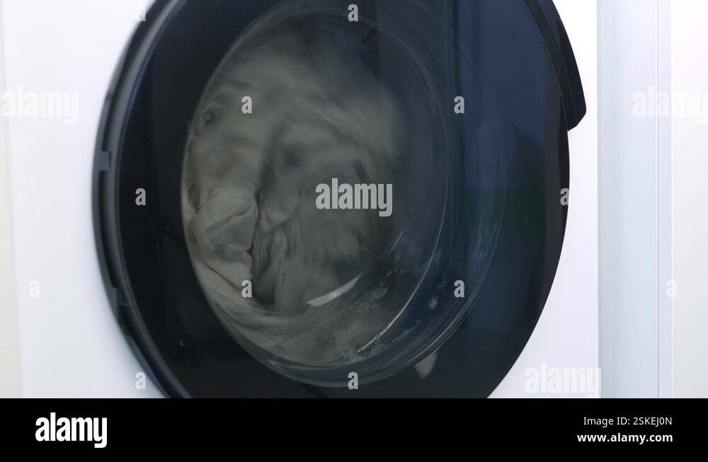 Laundry Machine Washing, Spinning, Rotating, and Cleaning White Wet ...