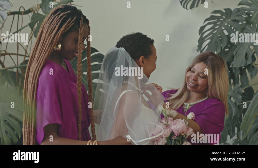 Bridesmaids Helping Bride to Get Dressed before Wedding Ceremony Stock ...