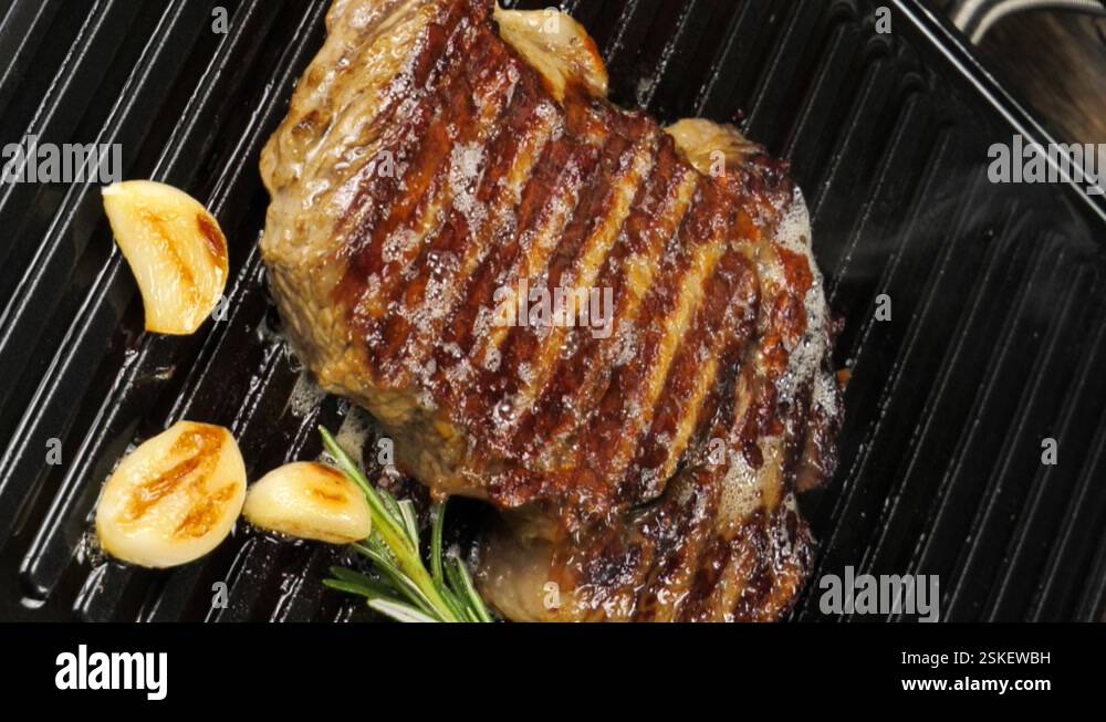 Delicious juicy meat steak cooked on the grill.Cooked juicy beef steak ...