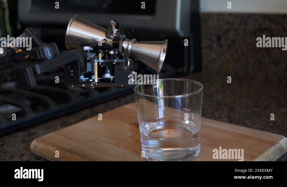 Robotic Hand Holding Jigger Stock Video Footage - Alamy