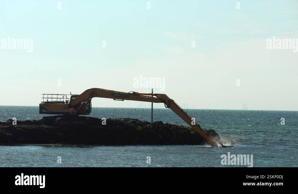 Hydraulic Excavator Dredging Silt From Ocean Bay Coastline, SLOW MOTION ...