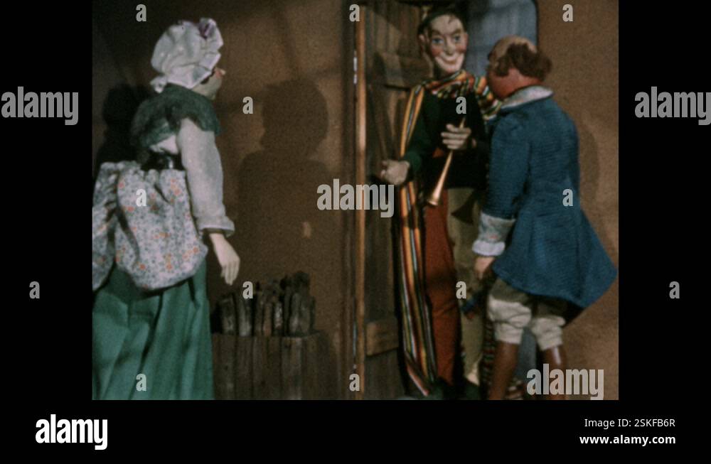1960s: Puppet show. Pied Piper speaks to man and woman in home Stock ...