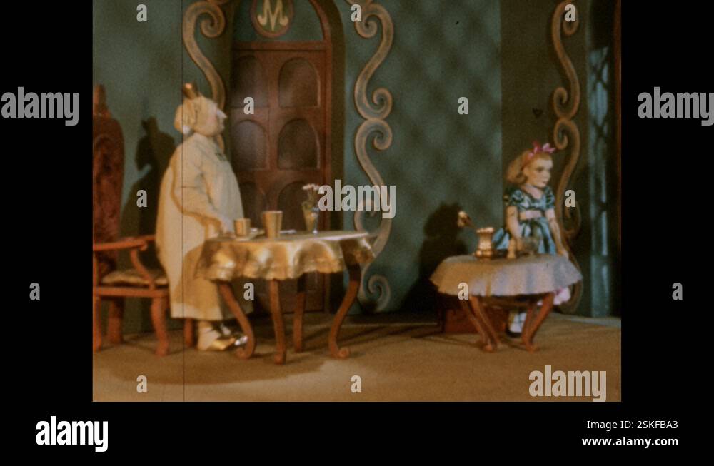 1960s: Puppets. Bedroom. People sit at tables. King and daughter walk ...