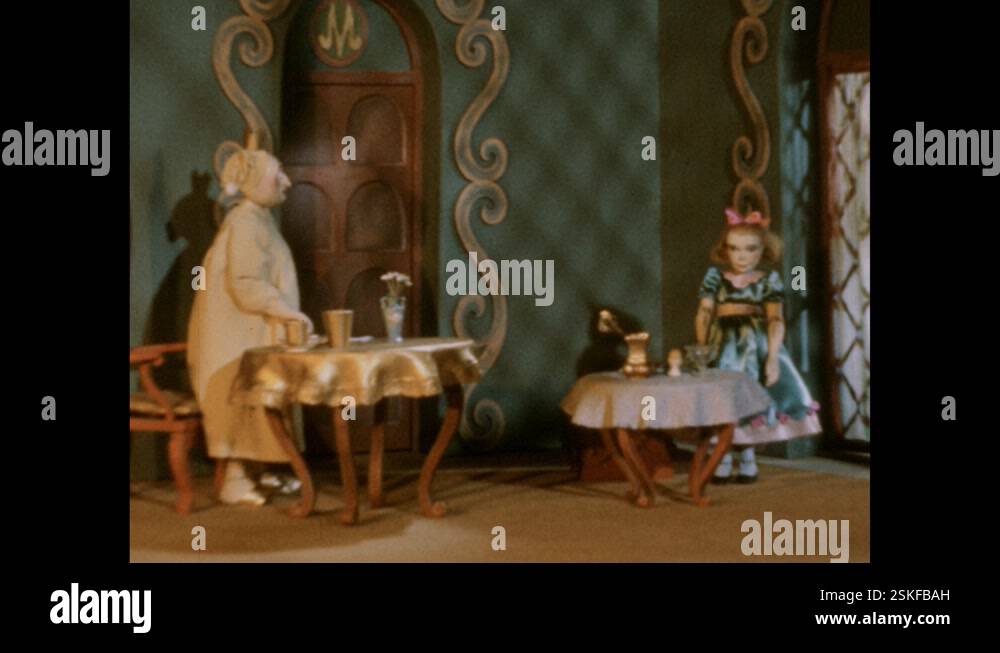1960s: Puppets. Bedroom. People sit at tables. King and daughter walk ...