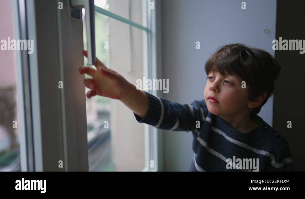 Boy holding window Stock Videos & Footage - HD and 4K Video Clips - Alamy
