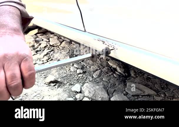 Auto repair worker straightening Stock Videos & Footage - HD and 4K ...