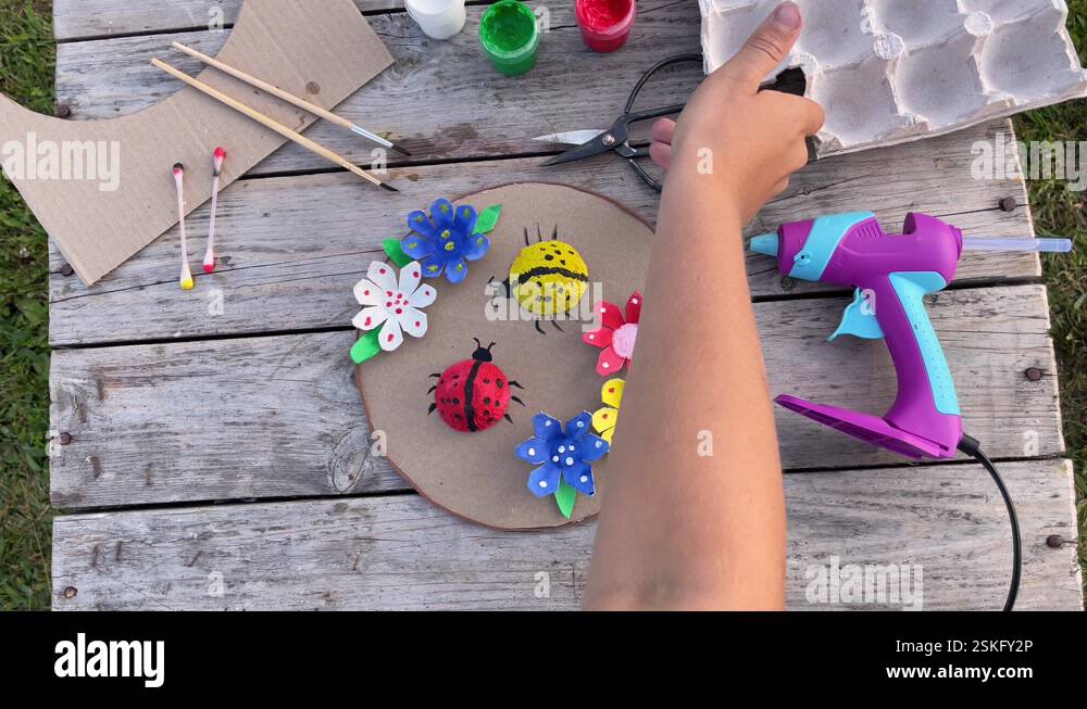 DIY flowers and lady bug from recycling egg boxes. Zero waste concept ...