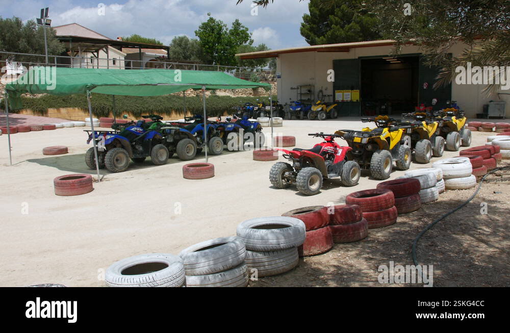 Quad bikes at a quad bike rental station at a race track trail Stock ...