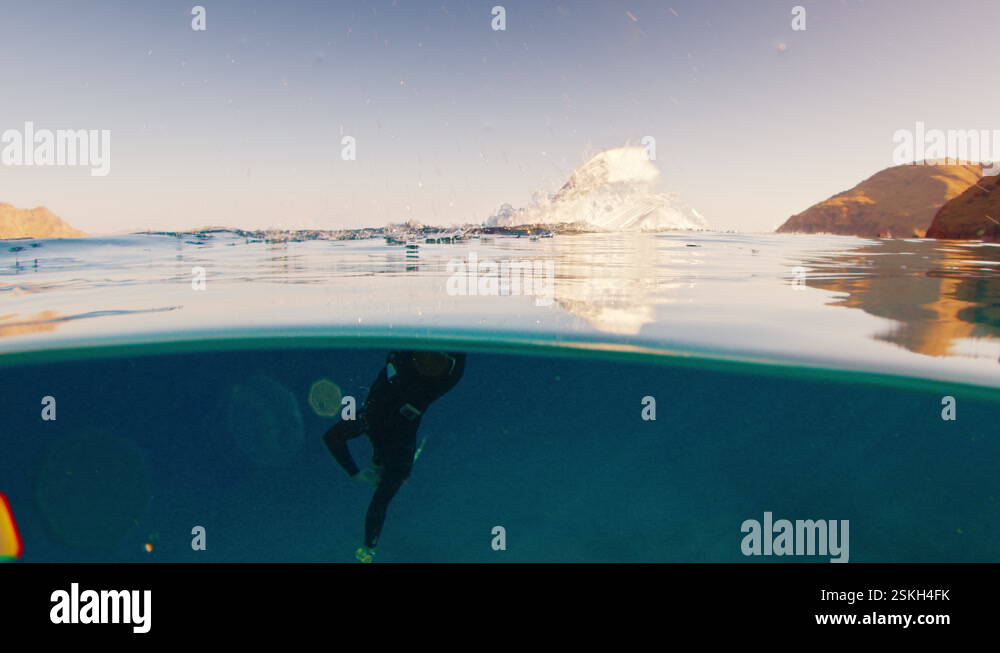 Duck dive freediving. Male freediver does duck dive and freedives in ...