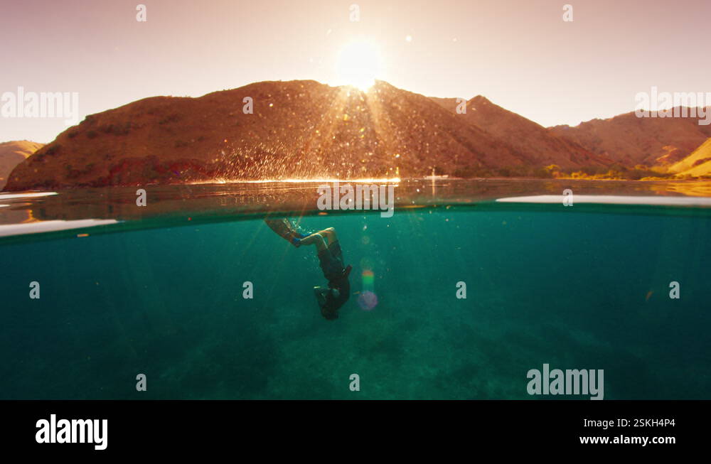 Duck dive freediving. Male freediver does duck dive and freedives in ...