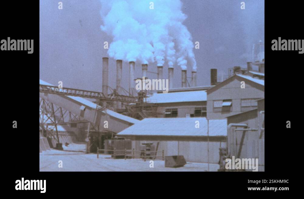 1960s: Smoke rises from smoke stacks at above ground mining buildings ...