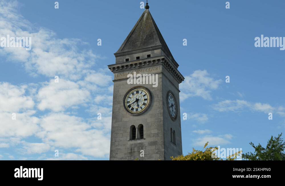 Clock Tower with Union Jack flags, in small English town, in 4K, Slow ...