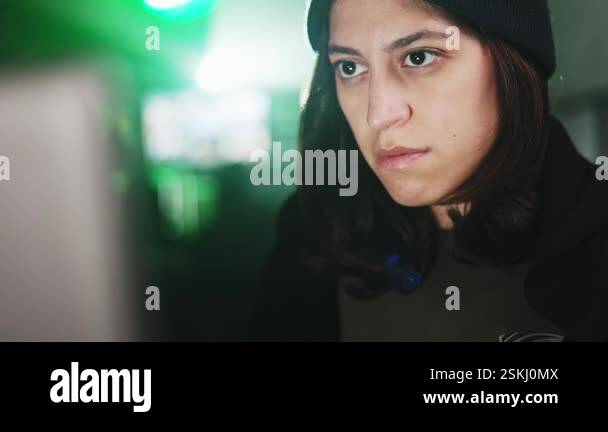 Female hacker breaking into a secure network, programming malicious ...