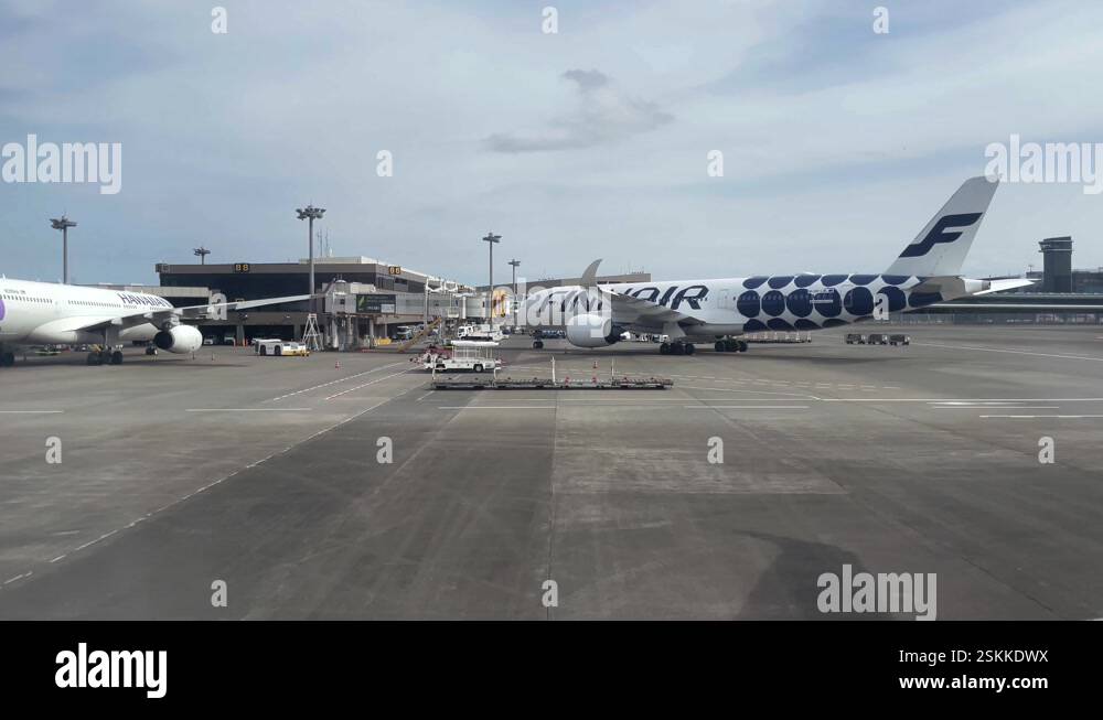 TOKYO, JAPAN : View of Haneda airport. Airplane and runway at Terminal ...