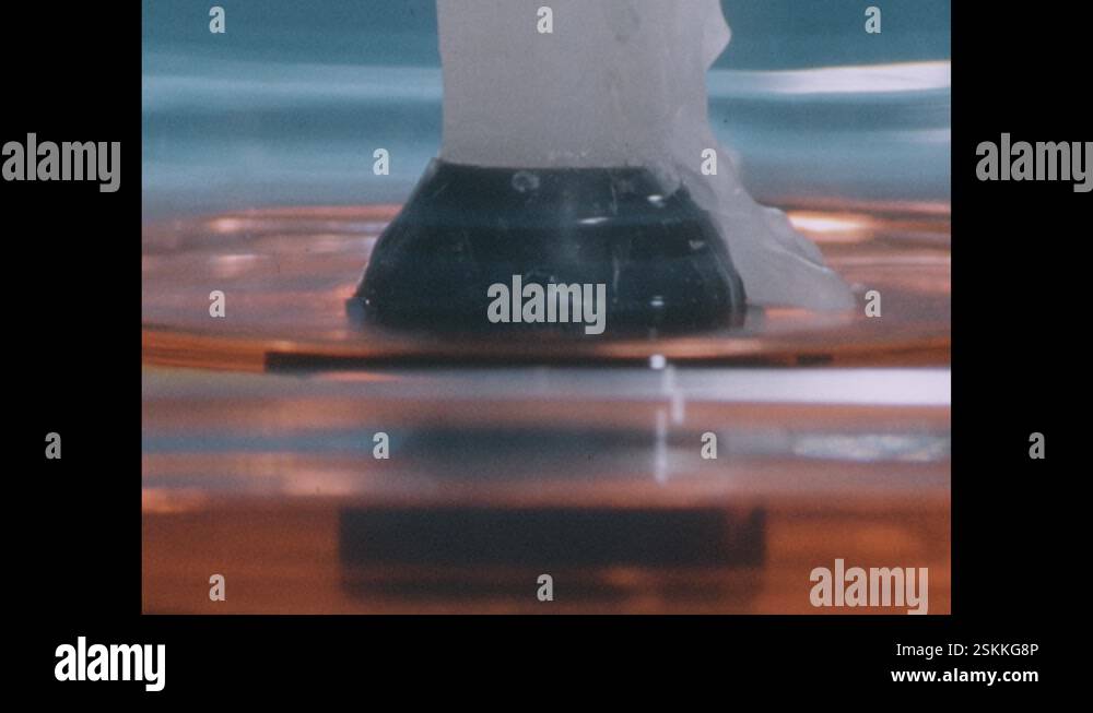1960s: Candle under glass container. Water level rises Stock Video ...