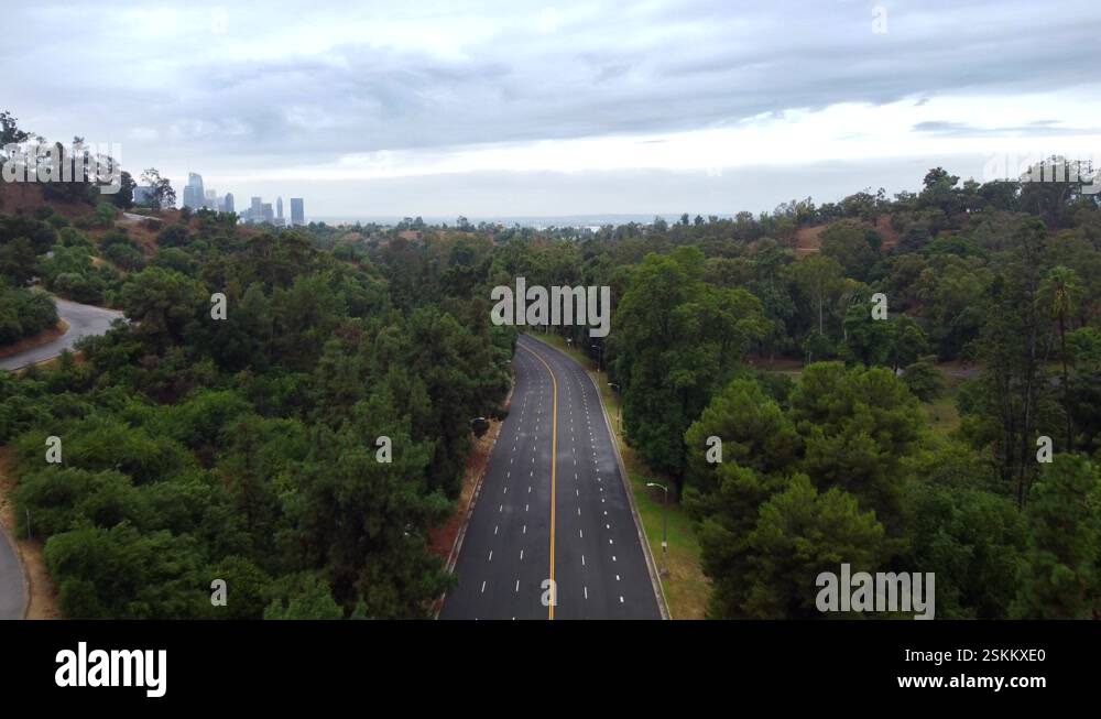 Drone shot flying over Stadium Way road in Elysian Park in Los Angeles ...