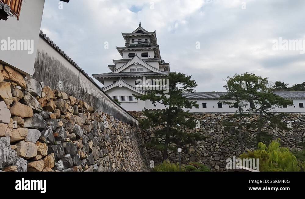 Imabari Castle and its steep stone walls and garden. Imabari city ...