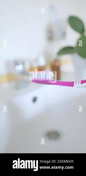 Brushing teeth before bed, woman holds a toothbrush and toothpaste ...