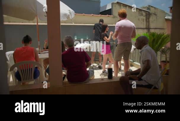 Backyard family gathering with multigenerational group, people ...