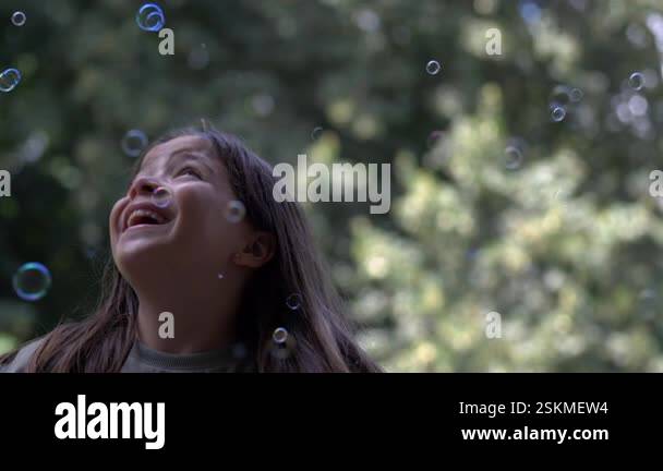 Girl laughing reaching bubbles in Stock Videos & Footage - HD and 4K ...