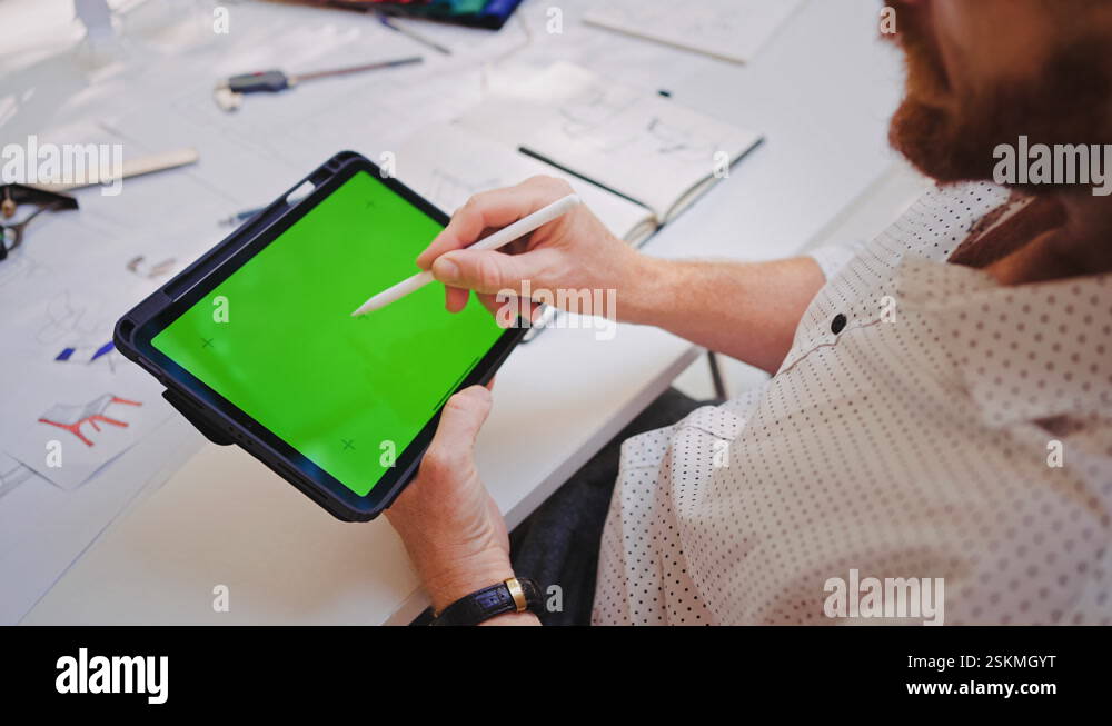 Designer drawing with stylus pen on chroma key tablet screen Stock ...