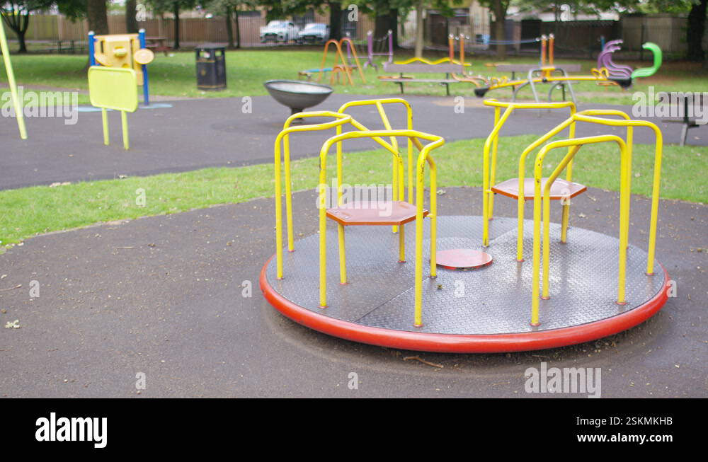 A roundabout in an empty playground spinning, in slow motion Stock ...