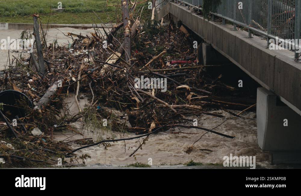 Severe floods damage trees debris blocks collapsed bridge river water ...