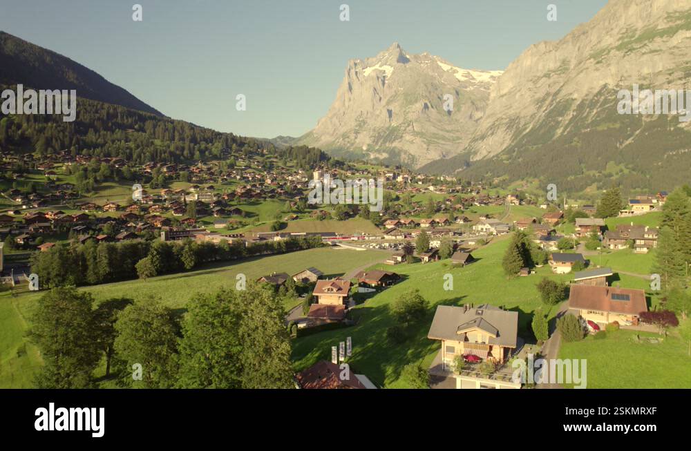 Pushing in towards Grindelwald Grund train station with unique views of ...