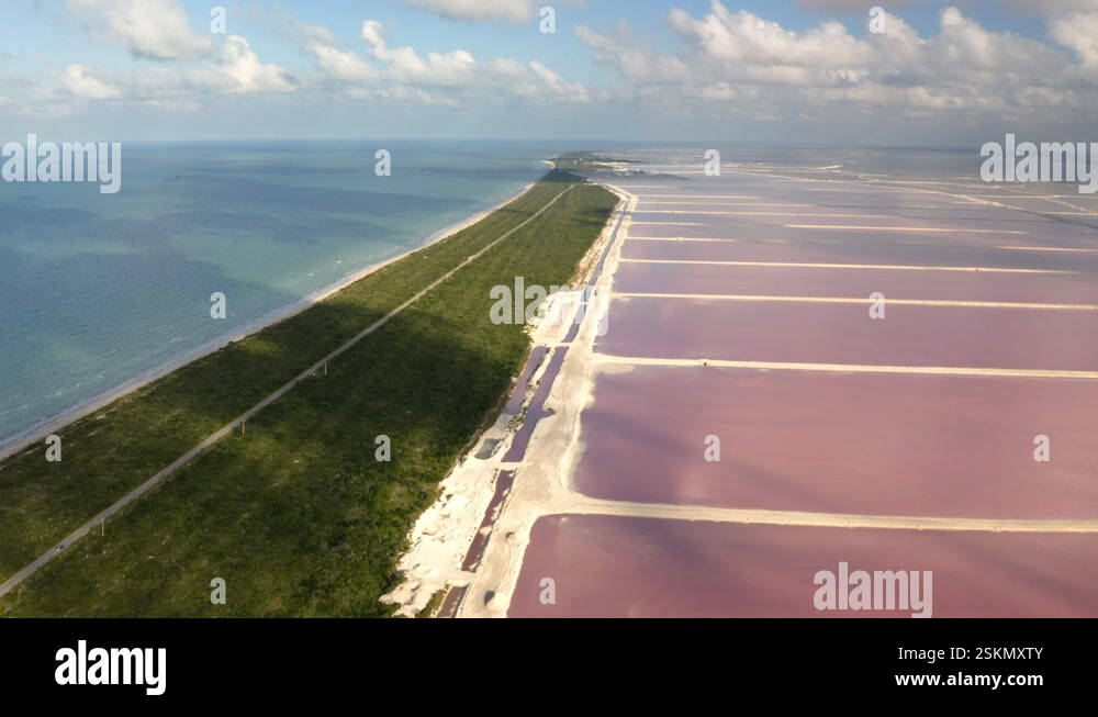 Salt ponds with pink water along coastal isthmus in Yucatan, Mexico ...