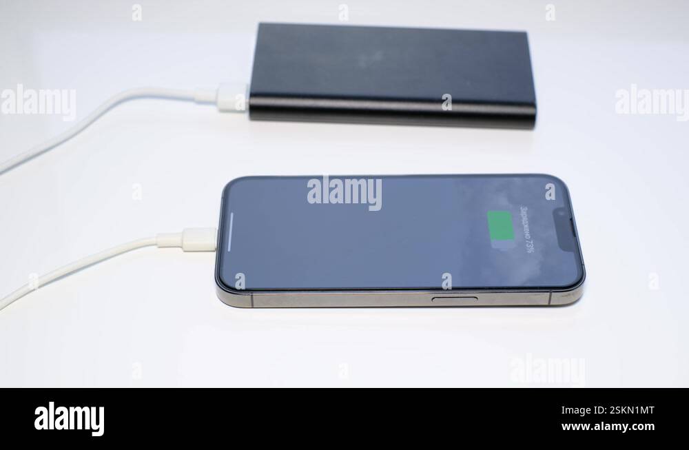Connecting a usb-c cable to an external Power Bank battery for charging ...