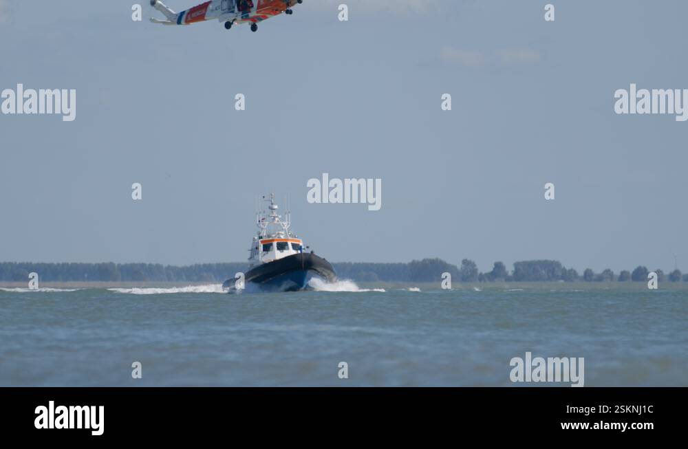 KNRM Dutch Coast Guard Rescue Lifeboat and SAR Helicopter at Sea Stock ...