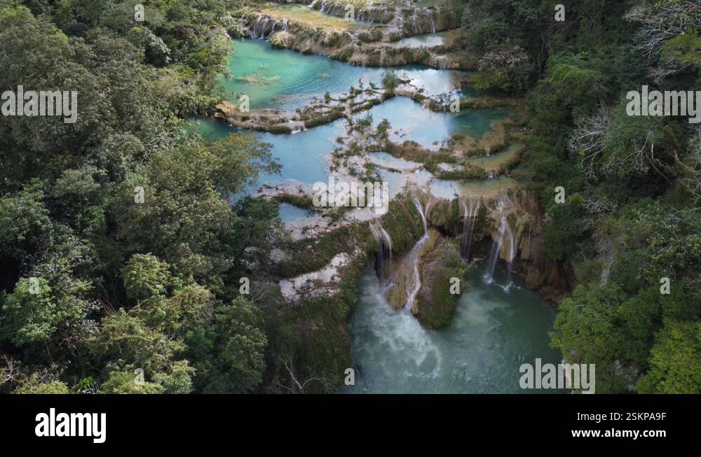 Water flows by underground cave and surface waterfalls, Semuc Champey ...