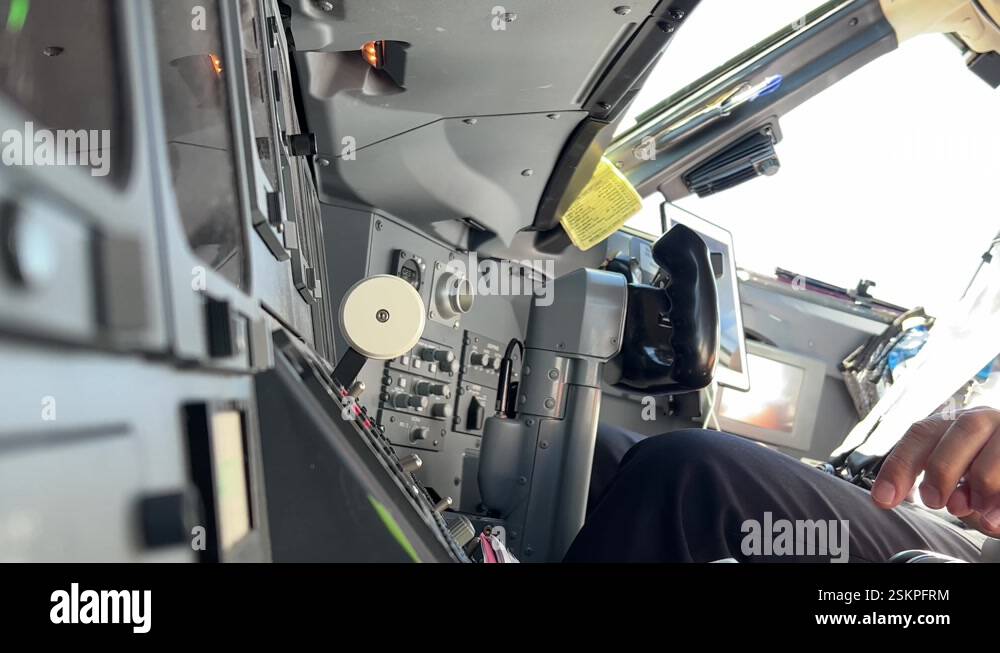 Scene in the airplane cockpit showing the pilot lowering the landing ...