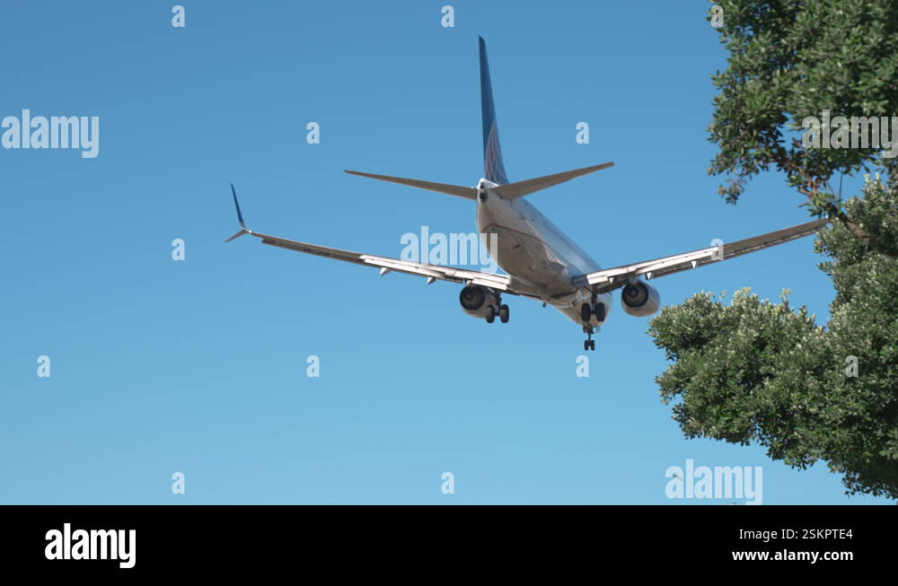 A commercial airplane on final approach to landing at LAX Los Angeles ...