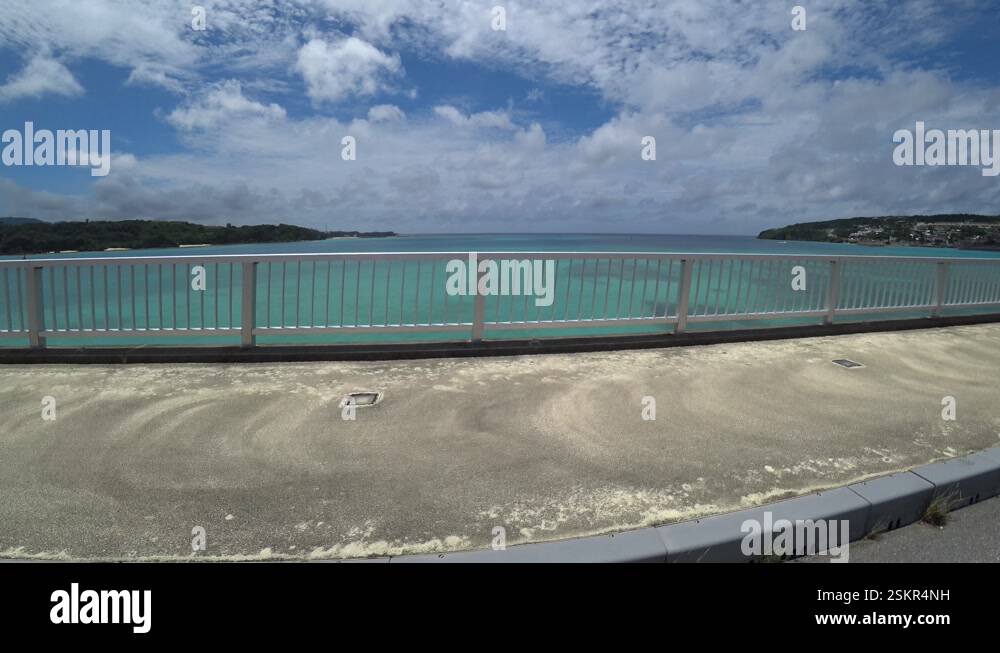 OKINAWA, JAPAN : Driving around Kouri Island bridge in sunny summer day ...