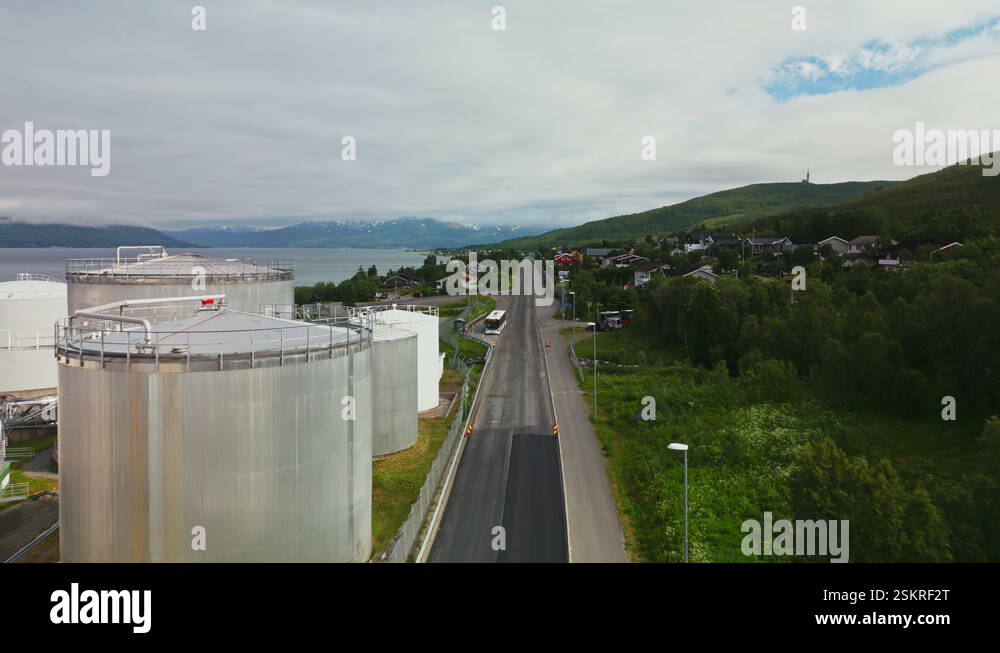 Industrial Storage Tanks For Oil And Gas Along Asphalt Roadway In ...