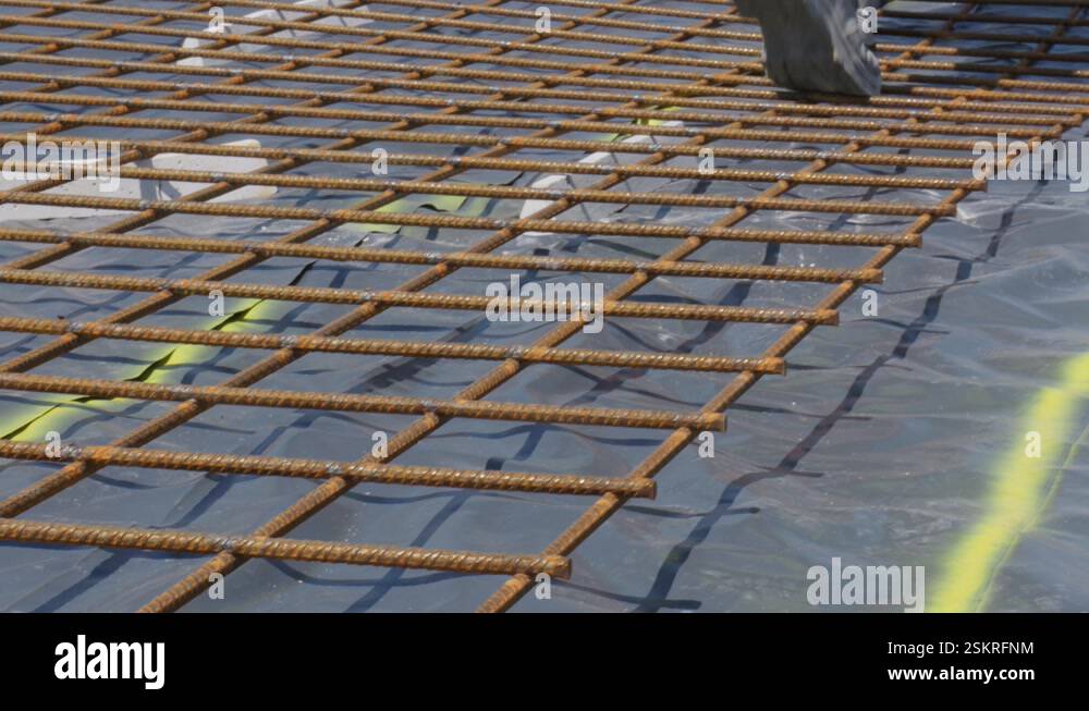 Steelman Tying Rebars In Grid Pattern For Concrete Pouring At Construction Stock Video Footage ...
