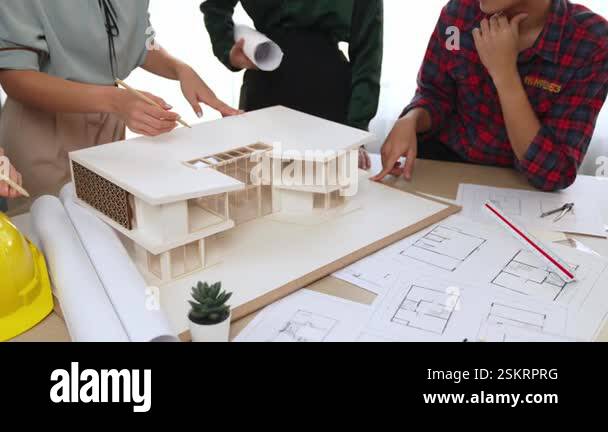 Slow motion home designer using architectural equipment review and ...