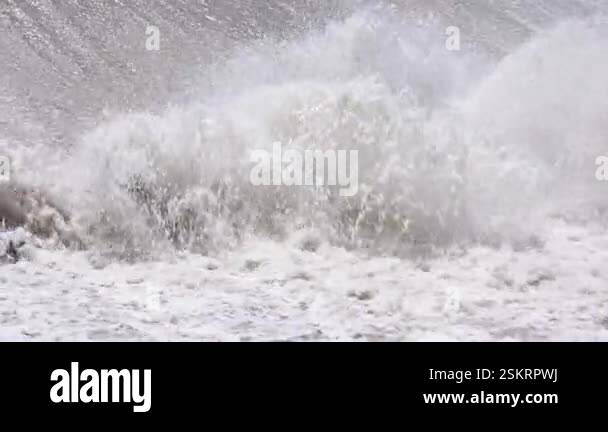 row of chute dentate blocks in concrete water spillway channel slope ...