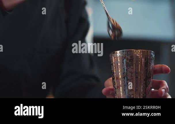 Closeup mixing hand bartender stirring mixed all ingredients alcohol ...