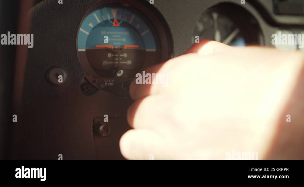 Man adjusting gauges and indicators in helicopter cockpit. Pilot ...