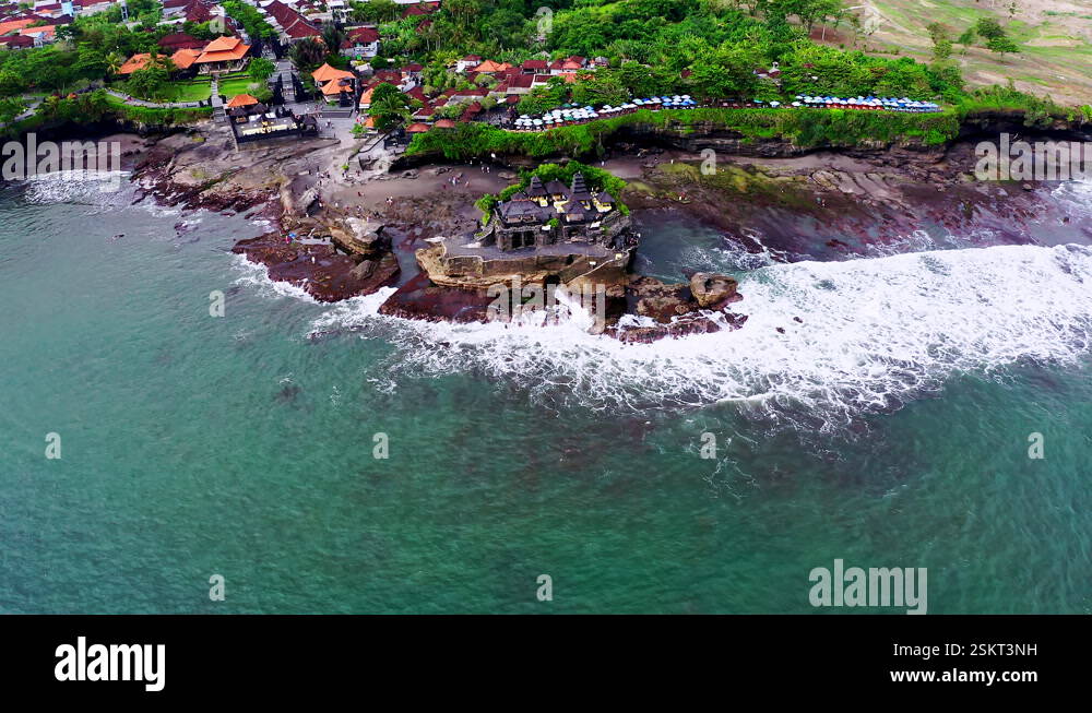 Ancient hindu Tanah Lot temple on rock formation in sea waves in Bali Stock Video Footage - Alamy