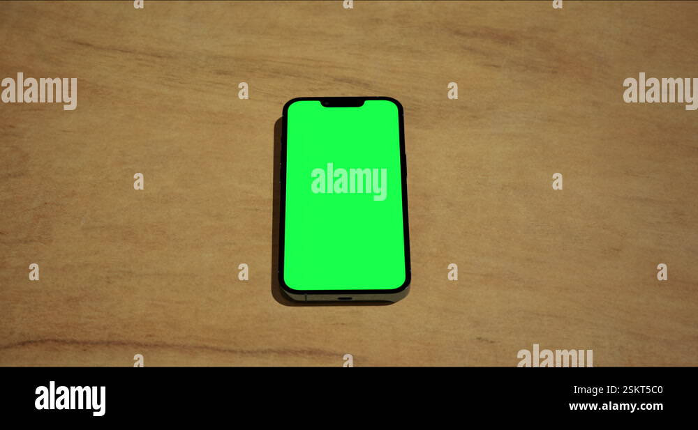 Smartphone place on wood table, Green screen telephone Stock Video ...