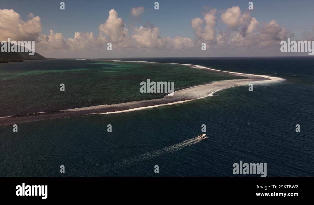 A speed boat explored the reef of Teahupoo on the island of Tahiti in ...